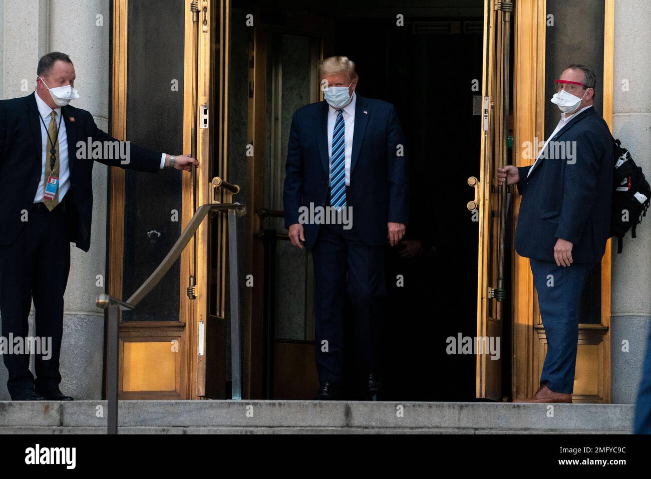 President Donald Trump walks out of Walter Reed National Military ...
