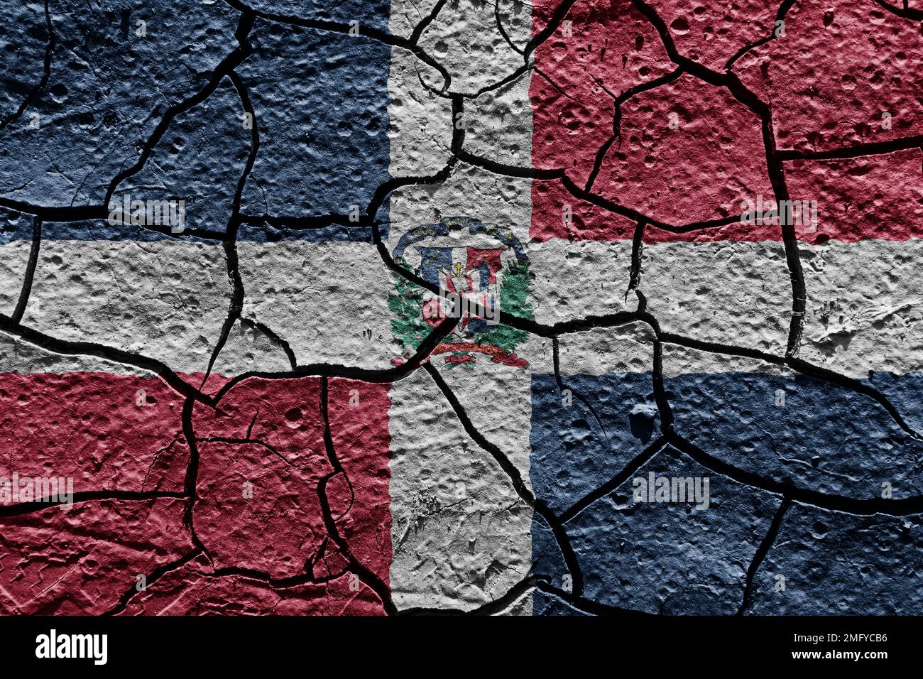 Dominican Republic flag on a mud texture of dry crack on the ground ...