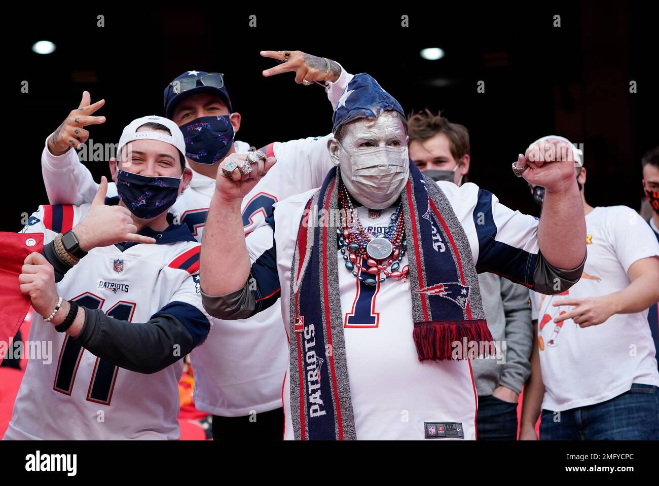 New England Patriots fans watch warmups before an NFL football game ...