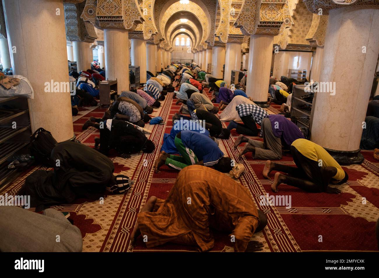 Pilgrims from the Mouride Brotherhood, pray in the Grand Mosque of ...