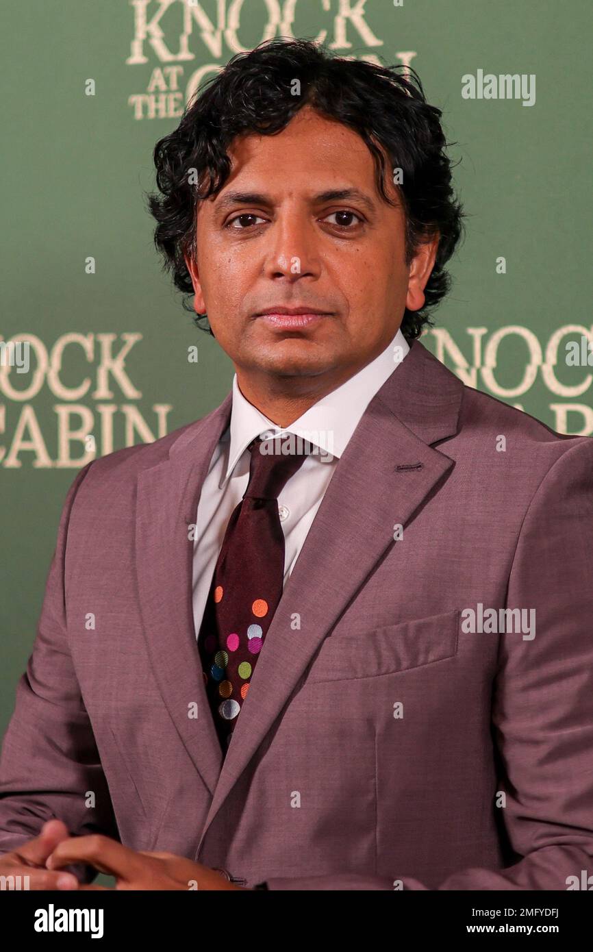 Director M. Night Shyamalan poses for photographers upon arrival at the ...