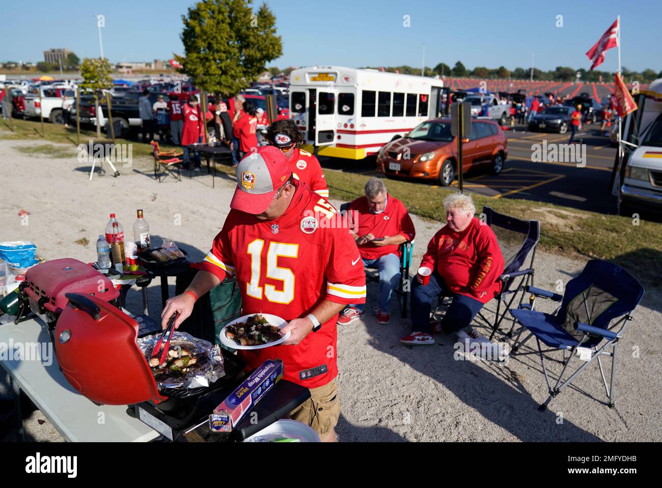 Fans tailgate outside Arrowhead Stadium before an NFL football game ...