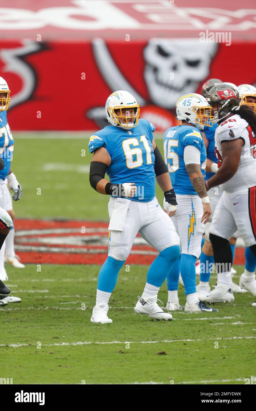 Los Angeles Chargers center Scott Quessenberry (61) looks on during a ...