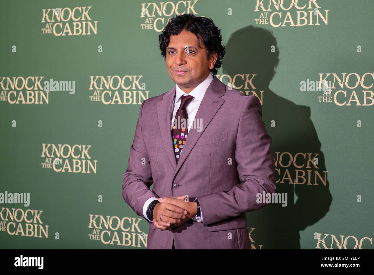 Director M. Night Shyamalan poses for photographers upon arrival at the ...
