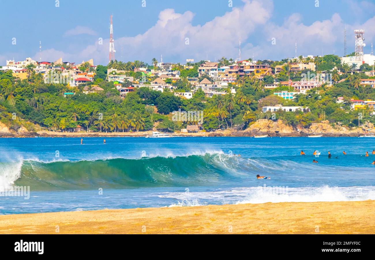 Surfer surfing on surfboard on high waves in Zicatela Puerto Escondido ...