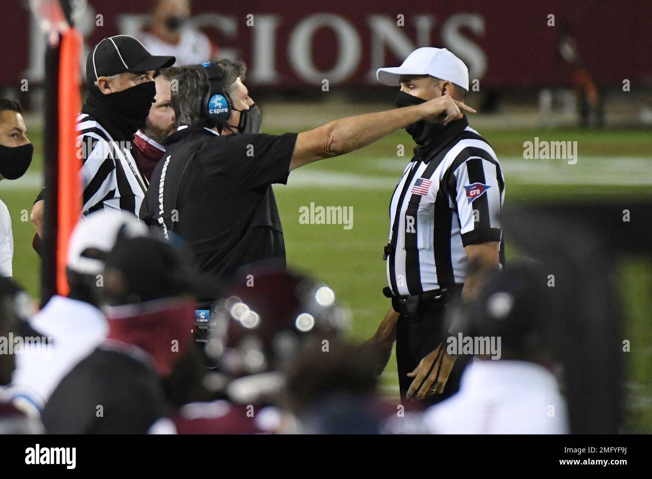 Mississippi State head coach Mike Leach talks to an official during the ...