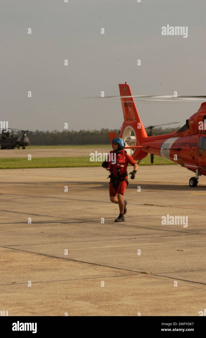 Aircrafts - HH-65 Dolphin - 26-HK-54-23. Rescue swimmer on ramp after ...