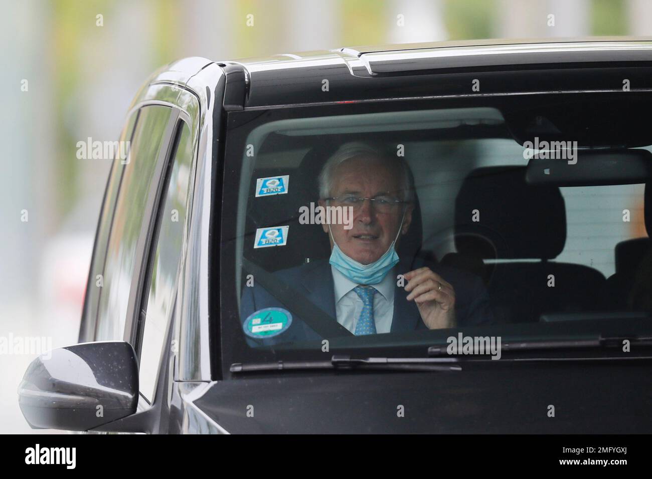 Chief EU negotiator Michel Barnier sits in a car as he leaves the ...