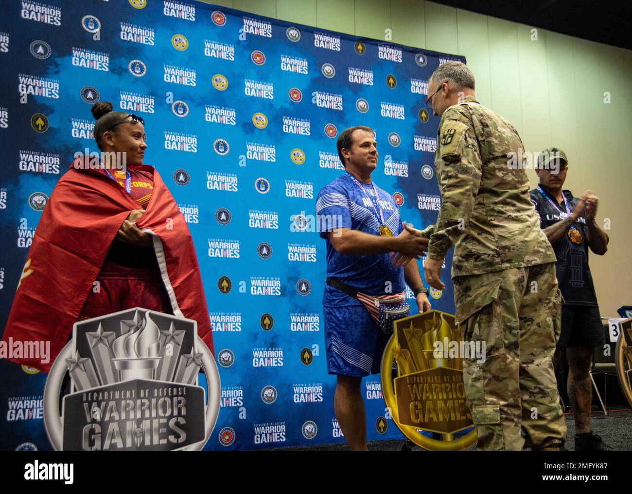 U.S. Air Force Master Sgt. Justin James shakes hands after being ...