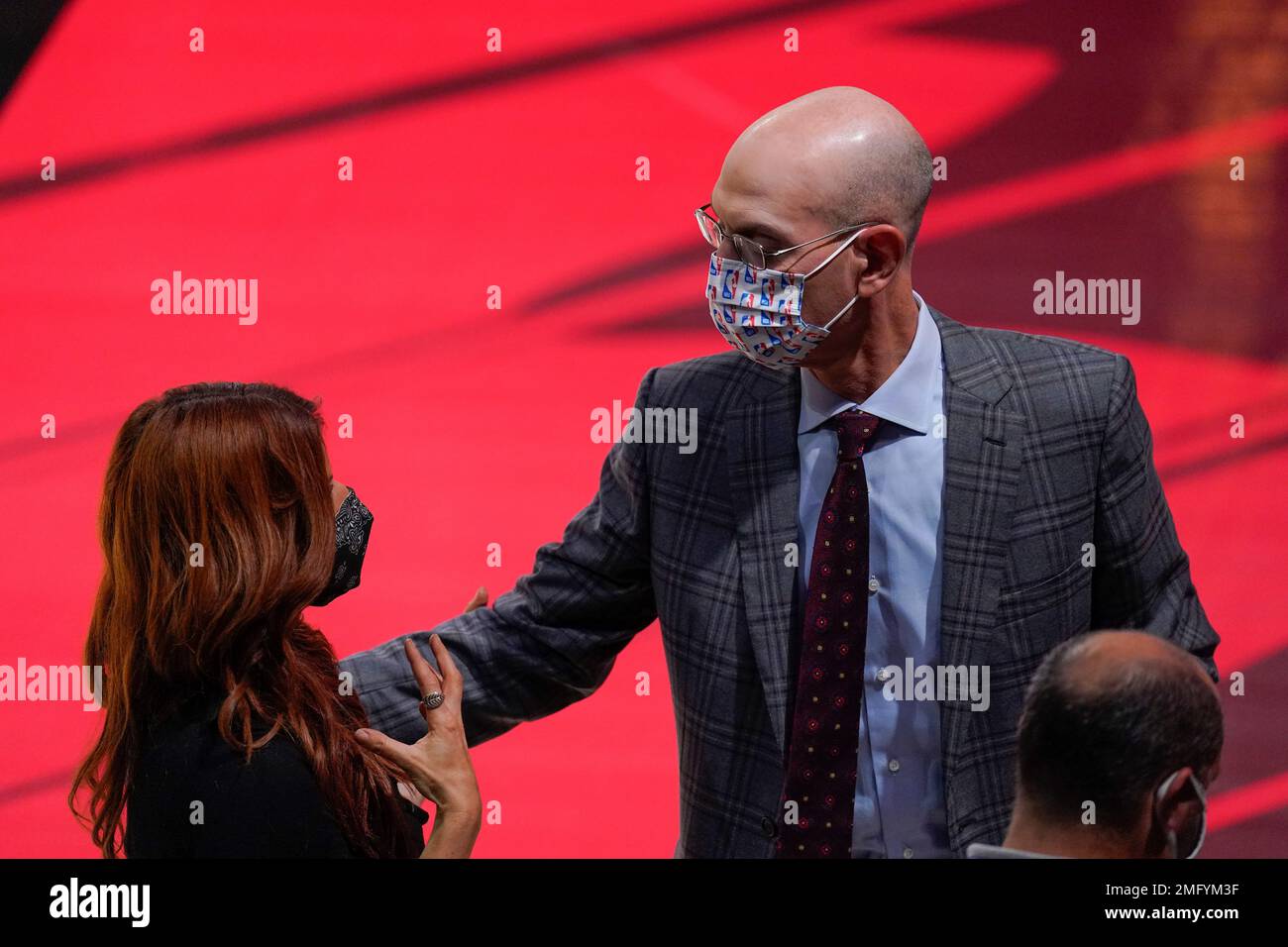 NBA Commissioner Adam Silver, right, speaks with a reporter after an ...