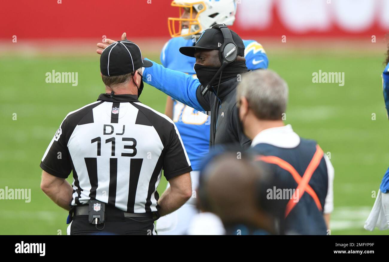 Los Angeles Chargers head coach Anthony Lynn talks to down judge Danny ...