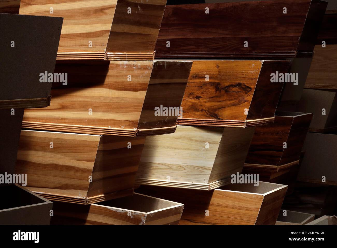 CORRECTS SPELLING OF NAME Coffins are stacked at Enzo Wood Designs, in ...