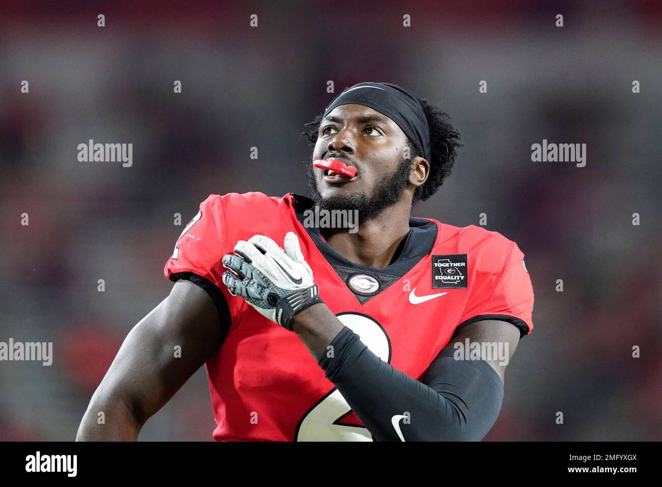 Georgia defensive back Richard LeCounte holds his shoulder during the ...