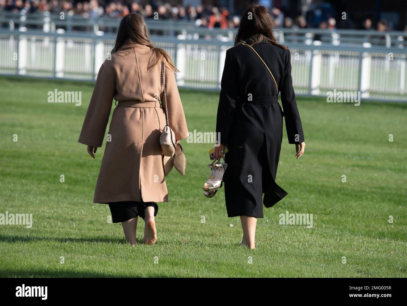 Windsor, Berkshire, UK. 10th October, 2022. Two racegoers with sore ...