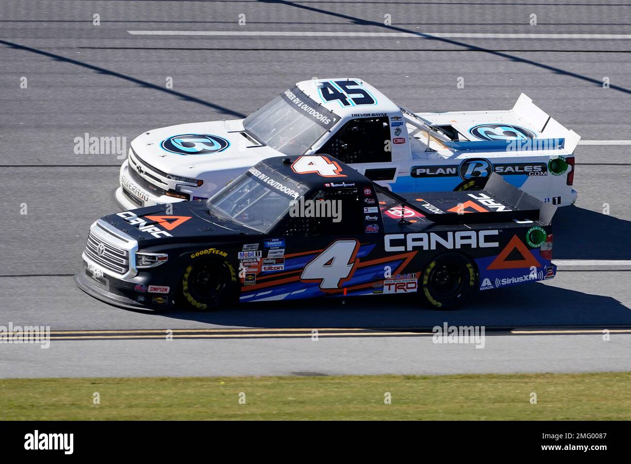 Raphael Lessard (4) races Trevor Bayne (45) to the finish line on the ...