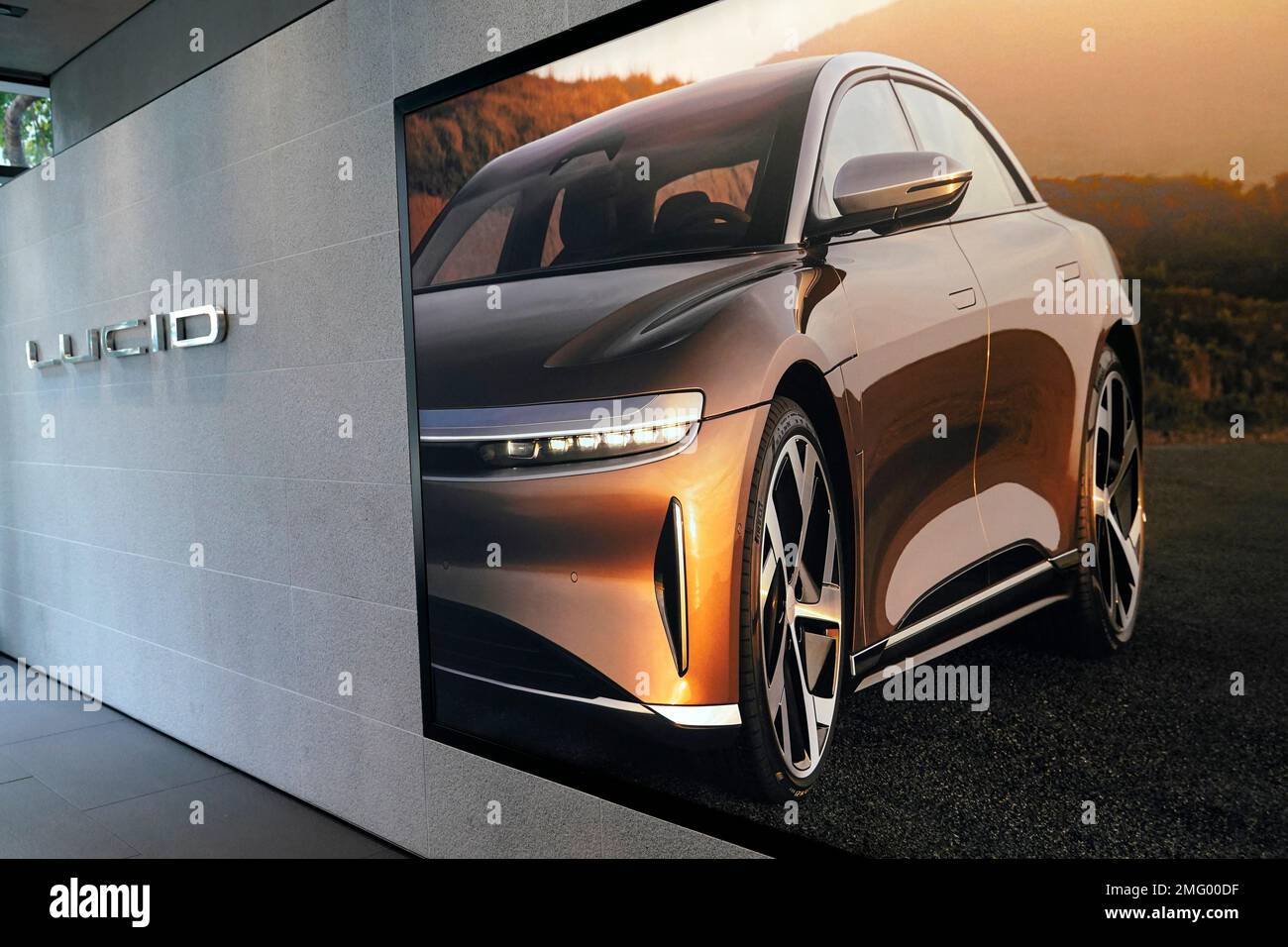 A 2022 Lucid Air Grand Touring electric vehicle is shown in a display ...