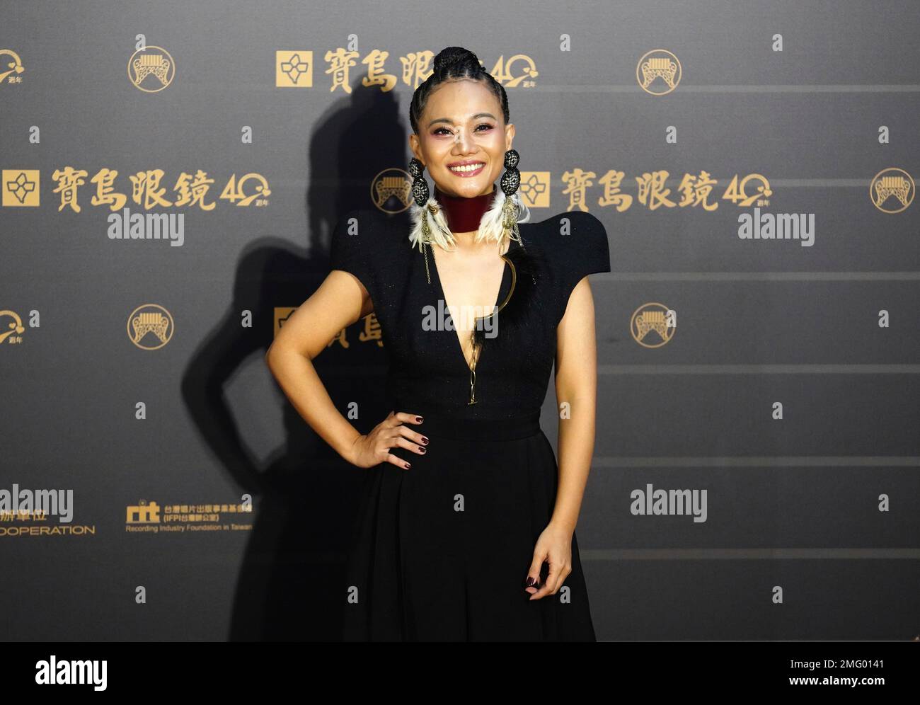 Taiwanese singer Abao poses as she arrives at the 31th Golden Melody ...