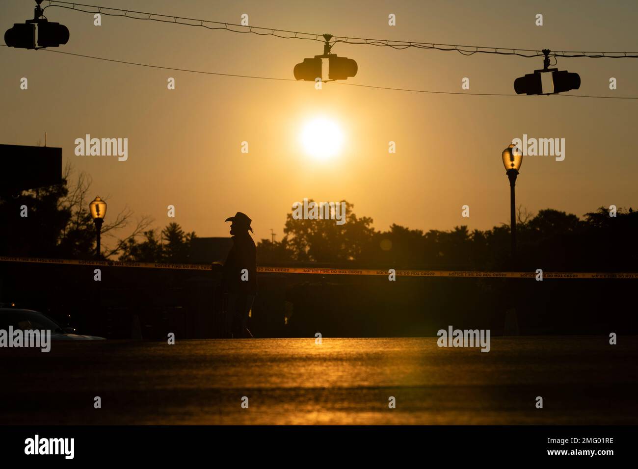 The sunrises as President Donald Trump supporter Richard Potcner walks ...