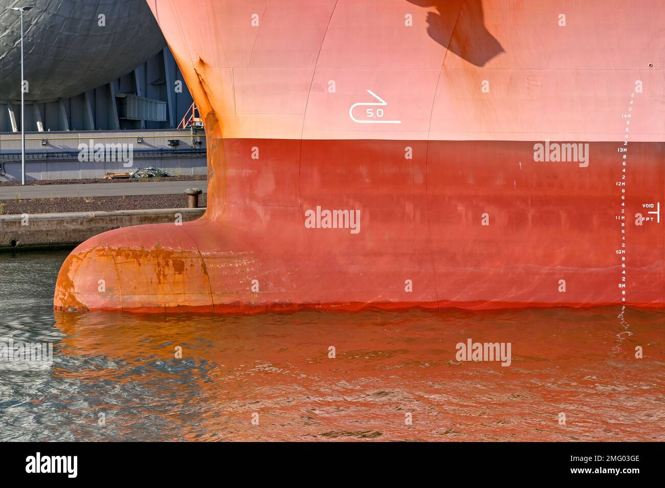 Close up view of the bulbous bow of a large cargo ship with painted ...