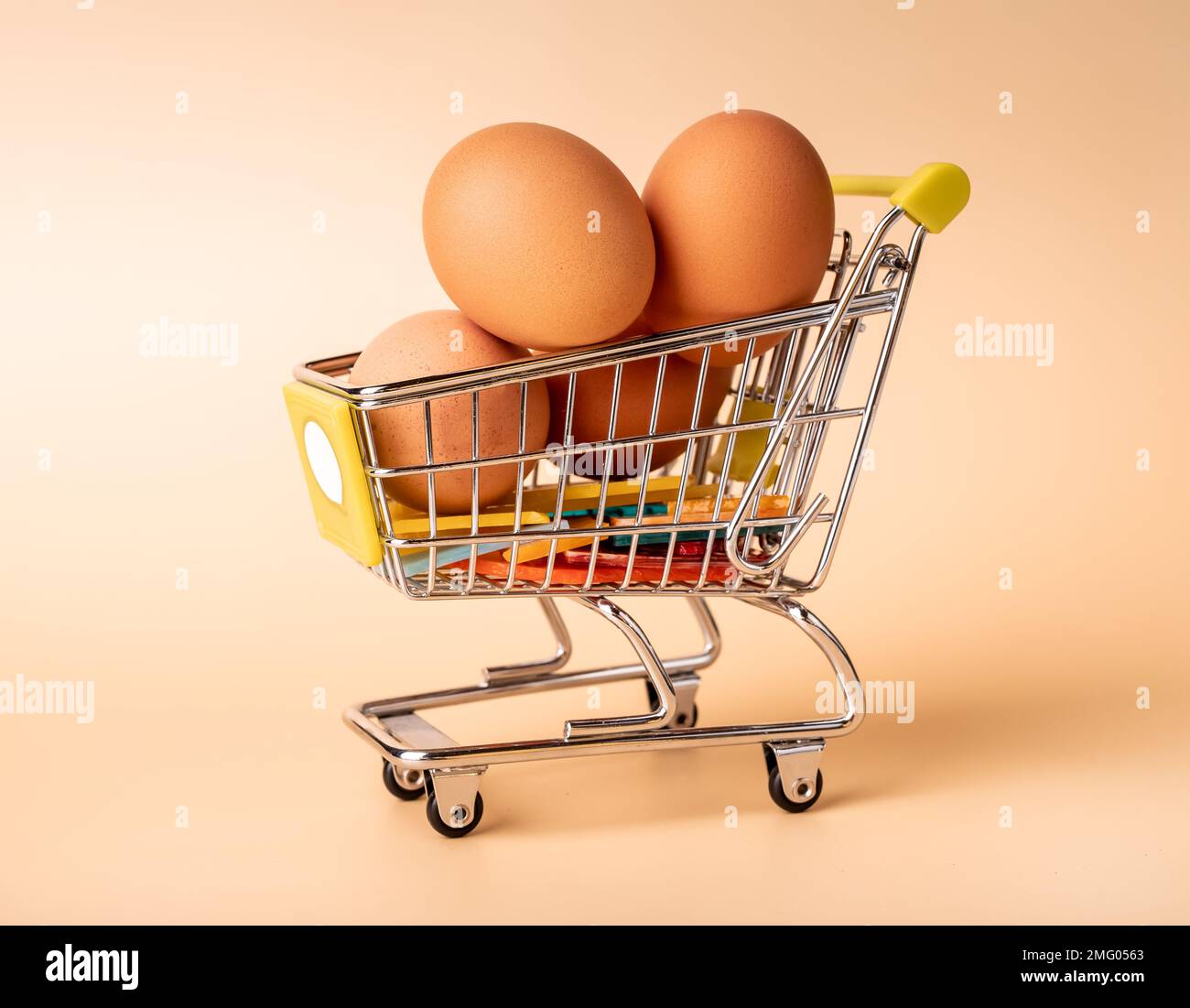Chicken eggs pile in shopping cart, trolley. High quality photo Stock ...
