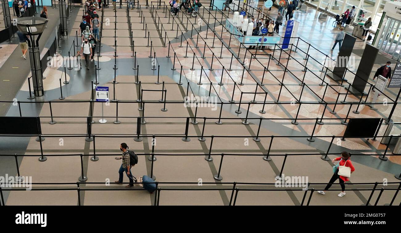 Travellers check in at the south security checkpoint in the main ...