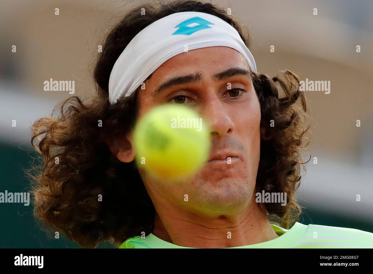 South Africa's Lloyd Harris plays a shot against Italy's Matteo ...