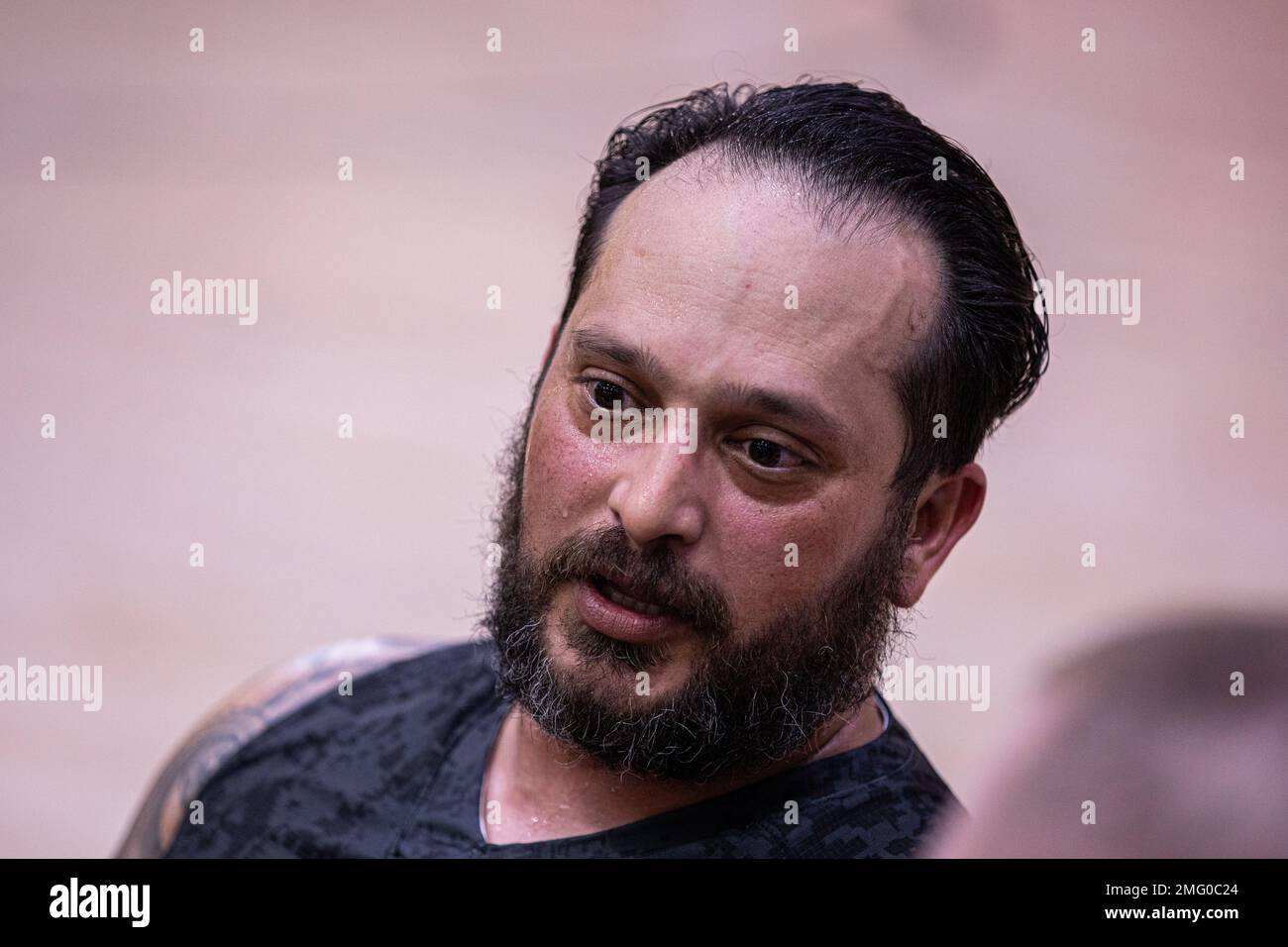 Retired U.S. Army Sgt. Christopher Montes listens to his coach during ...