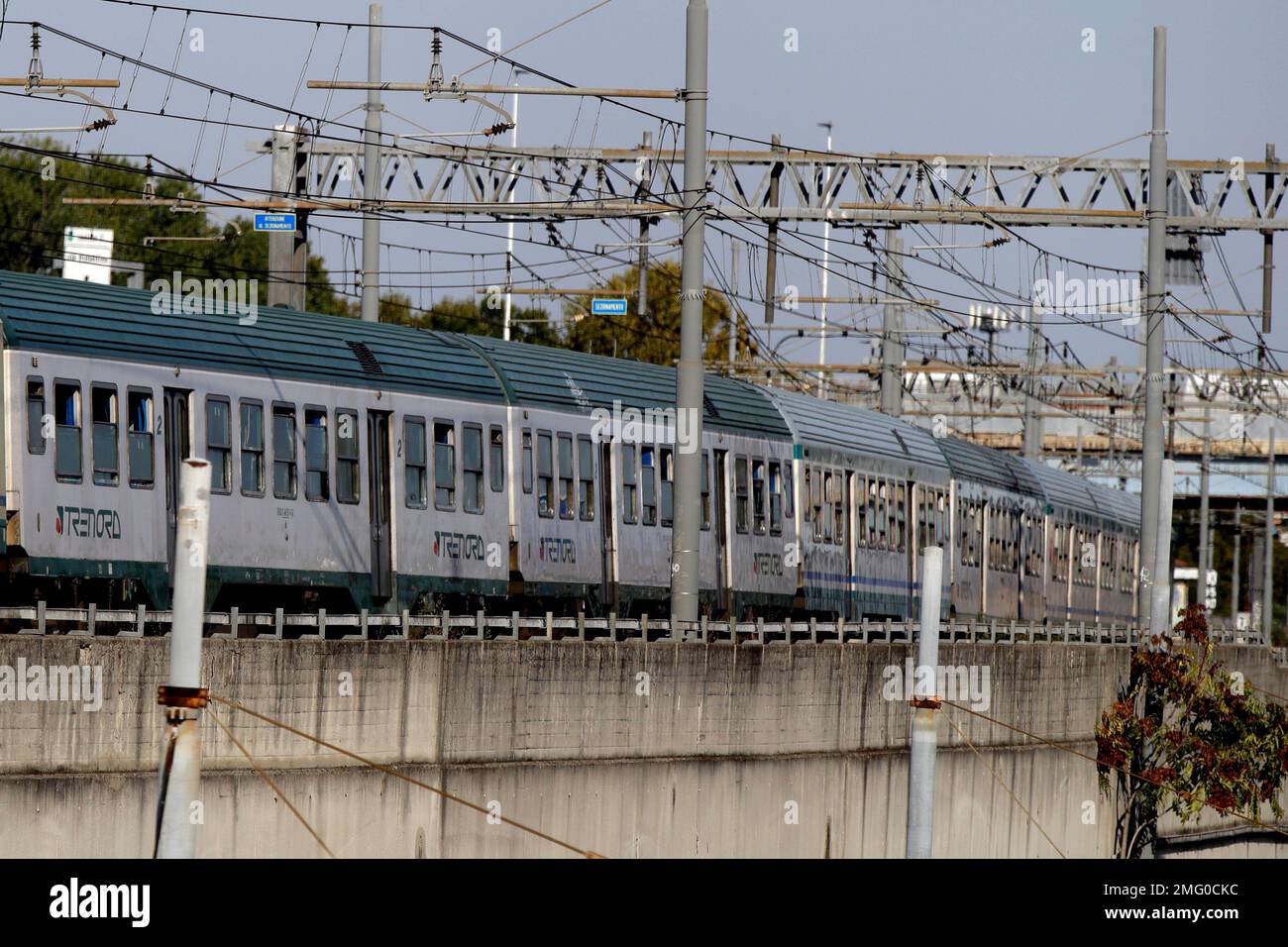 A Trenord train runs on the rails in Milan, Italy, Wednesday, Sept. 30 ...