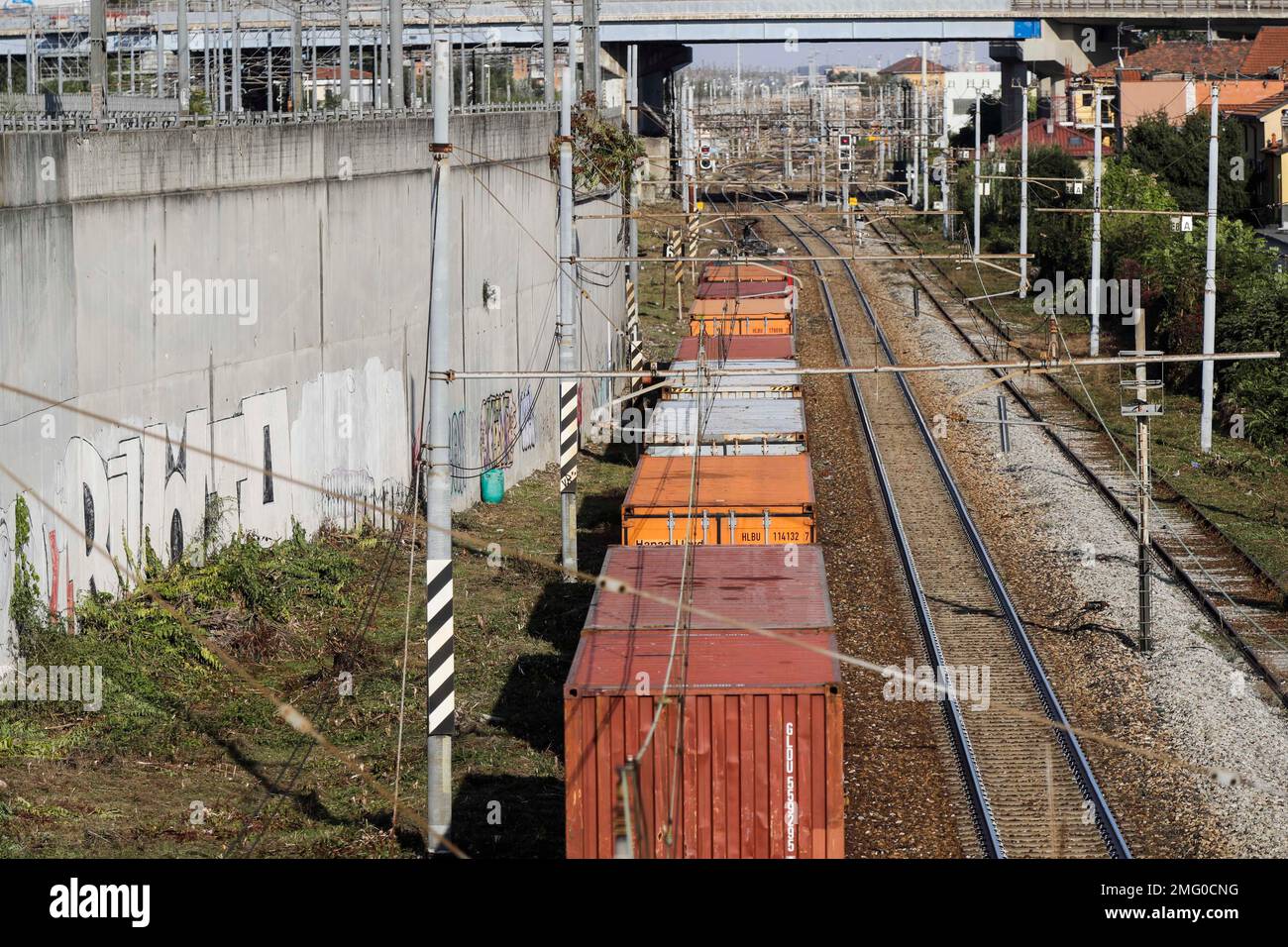 A freight train runs on the rails in Milan, Italy, Wednesday, Sept. 30 ...