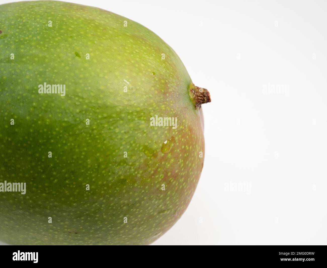 Ripe mango on a white background. Fresh mango. Close-up Stock Photo - Alamy