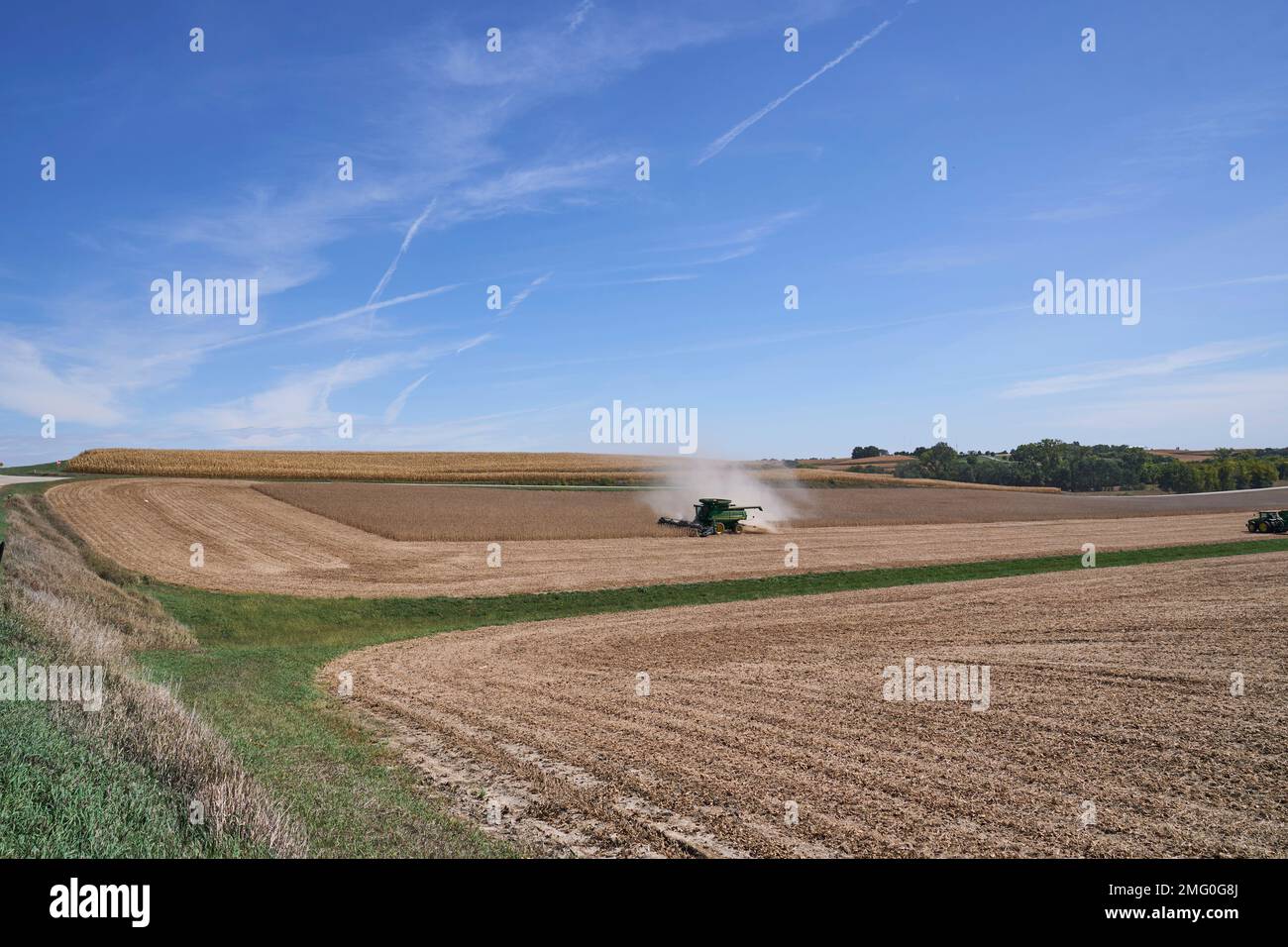 A combine harvests soy beans in Bennington, Neb., Tuesday, Sept. 29 ...