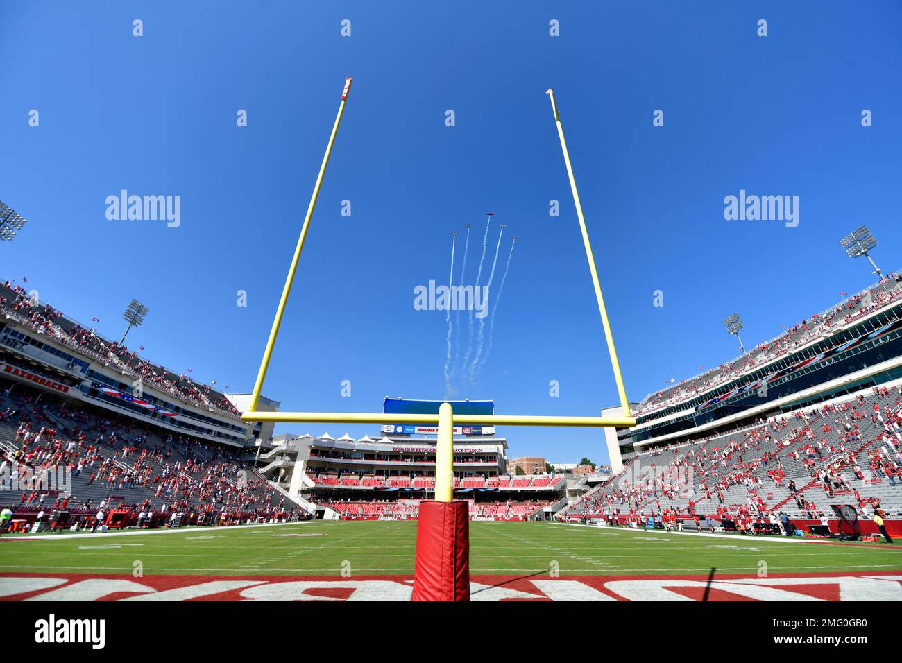 The Hog Formation Flight Team performs a flyover at Donald W. Reynolds ...