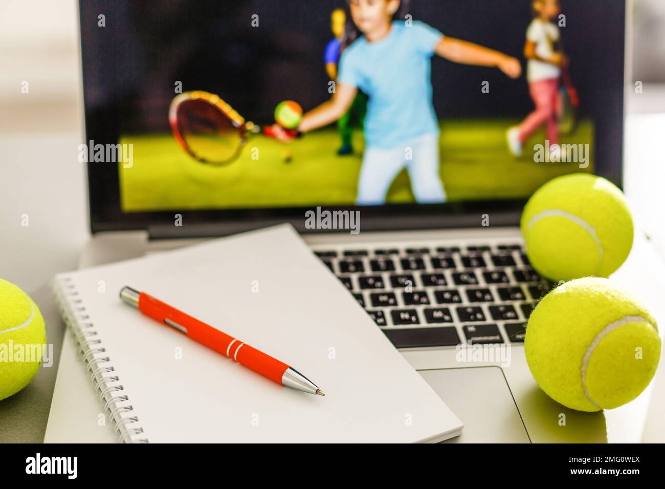 Sports tennis player with racket in blue costume. Woman atlete. Laptop ...
