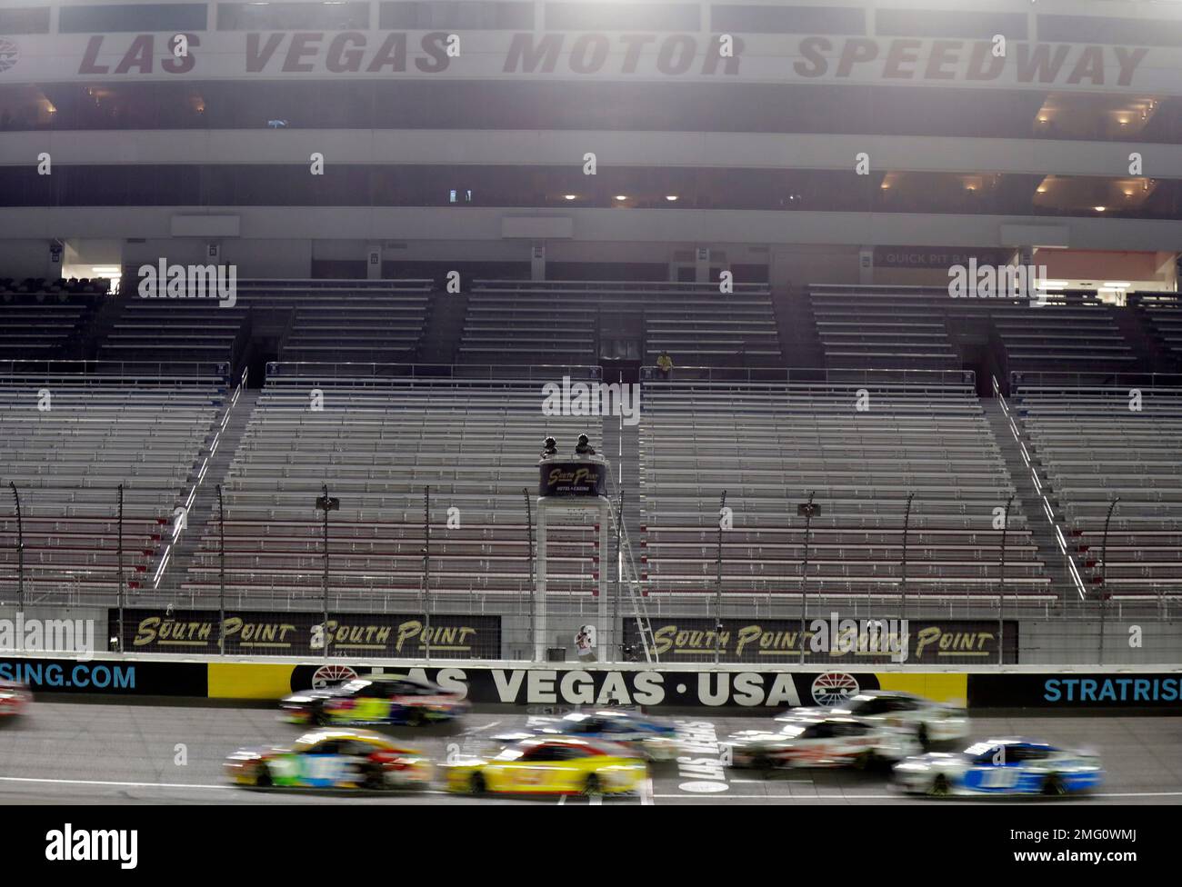 Drivers pass the start finish line during a NASCAR Cup Series auto race ...