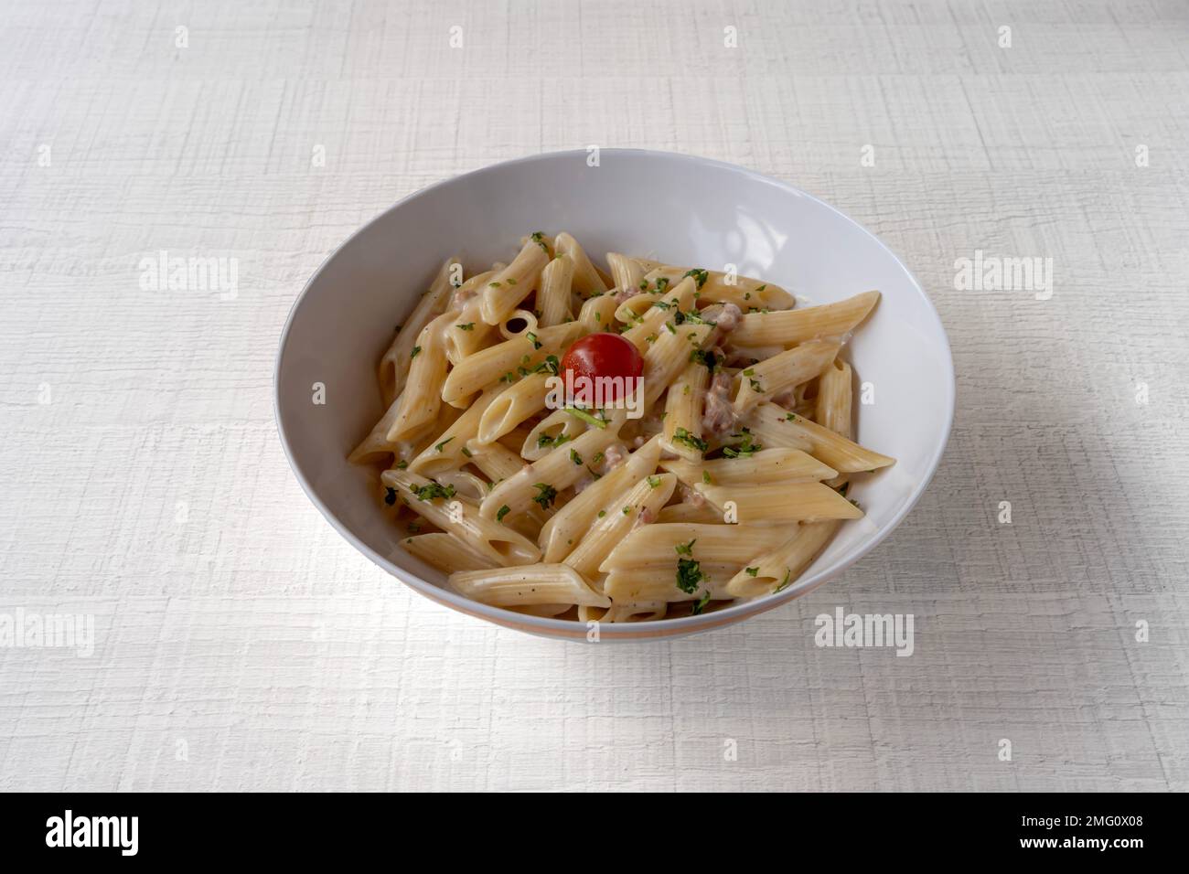 Italian dishe culinary Still Life. carbonara pasta with penne pasta ...