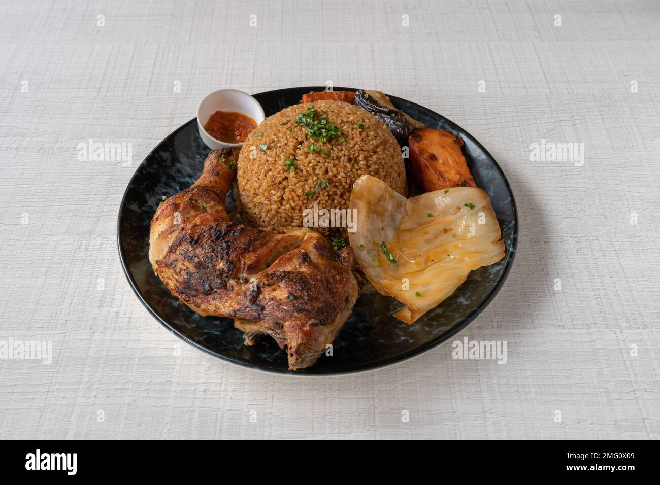 African dishe culinary Still Life. Chicken Thieb with Grilled chicken ...