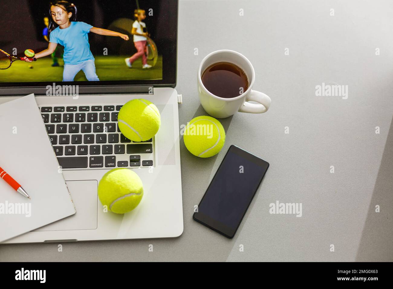 Sports tennis player with racket in blue costume. Woman atlete. Laptop ...