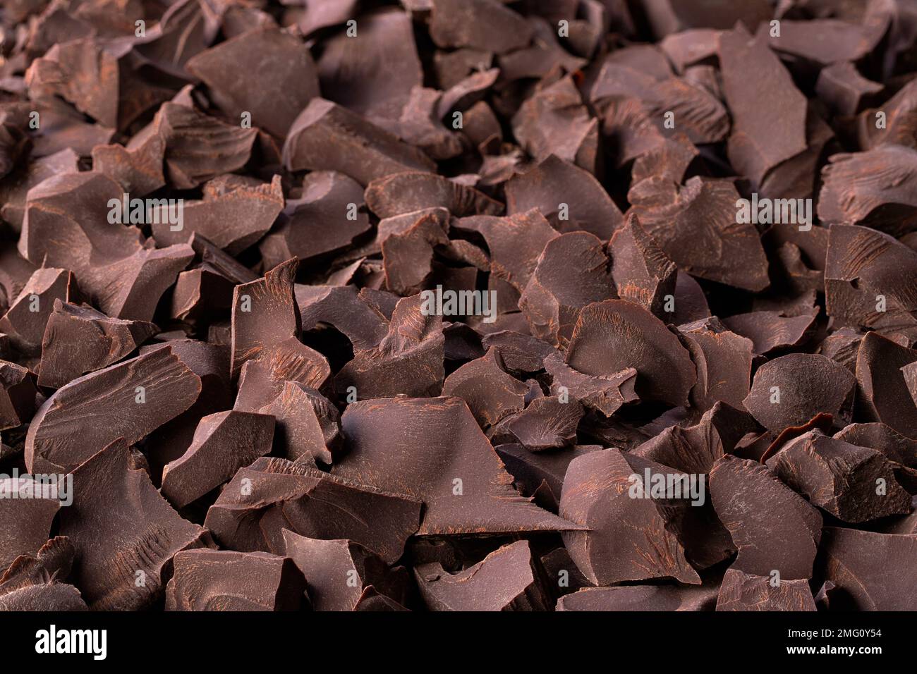heap of broken bitter chocolate, dessert food background Stock Photo ...