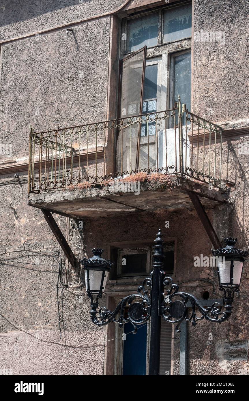 Old retro balcony of aged weathered house facade closeup Stock Photo ...