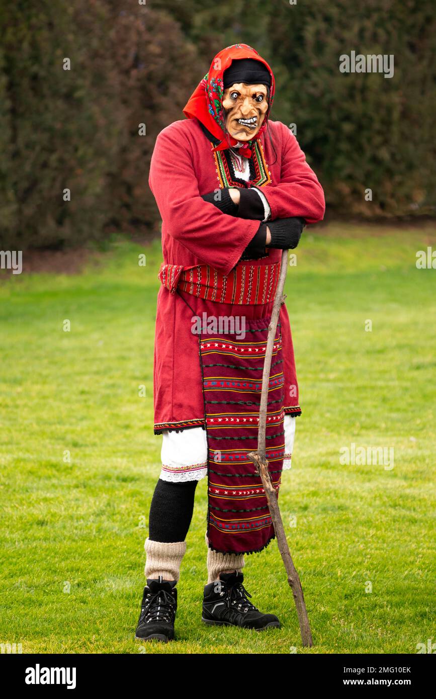 Participant in funny costume at the annual Simitlia winter Kukeri ...