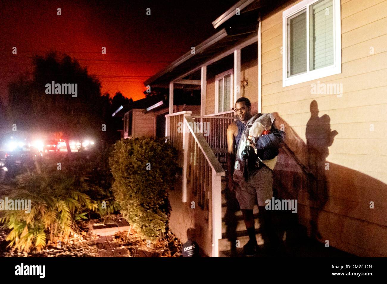 Eddy Whitmore evacuates from his Santa Rosa, Calif., home as the Shady ...