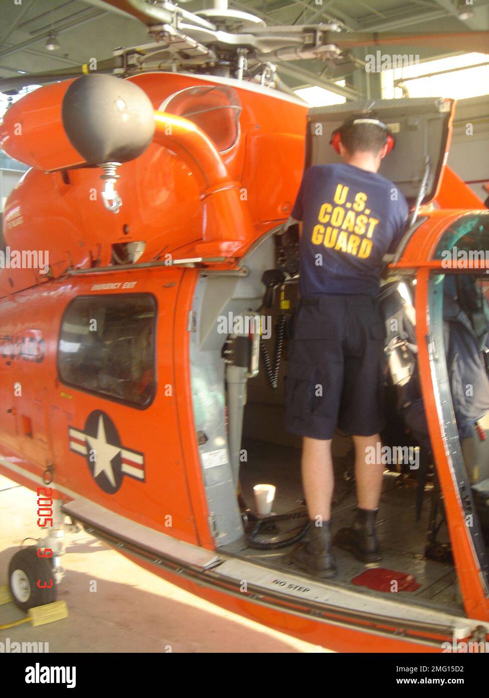 Aircrafts - HH-65 Dolphin - 26-HK-54-38. Coast Guardsman working on HH ...