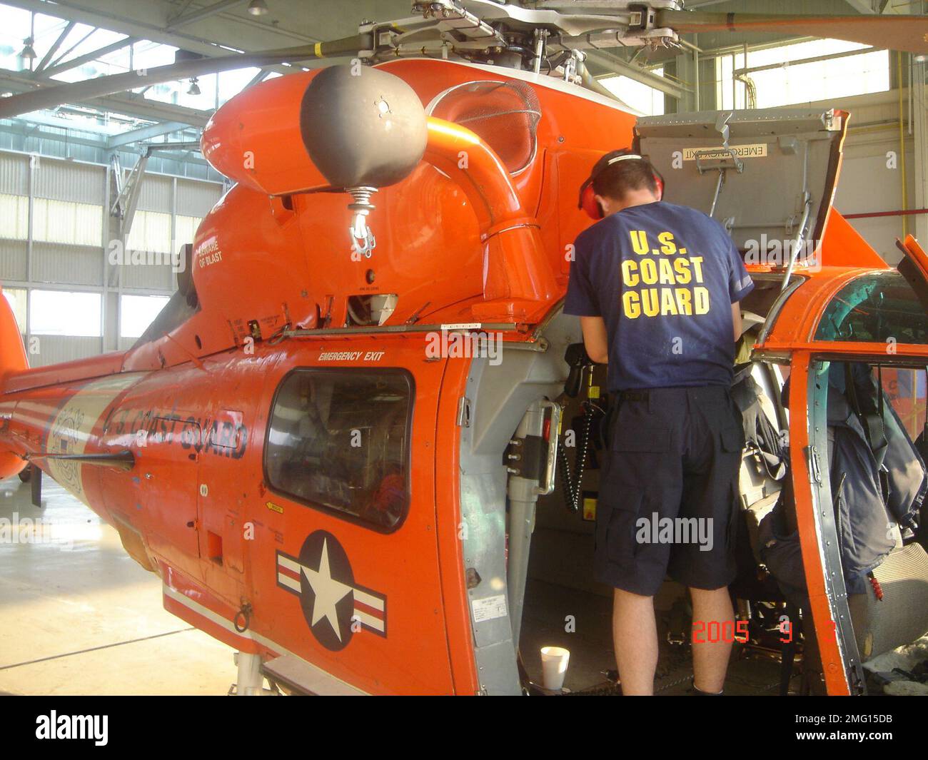 Aircrafts - HH-65 Dolphin - 26-HK-54-39. Coast Guardsman working on HH ...