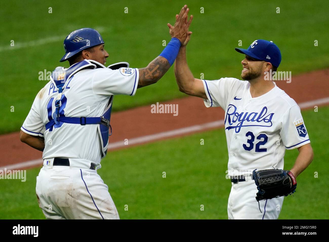 Kansas City Royals catcher Salvador Perez (13) and relief pitcher Jesse ...