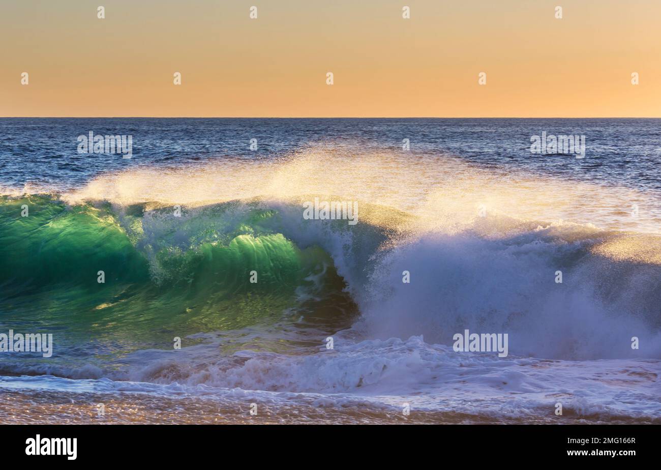 Blue wave on the beach. Dramatic natural background Stock Photo - Alamy