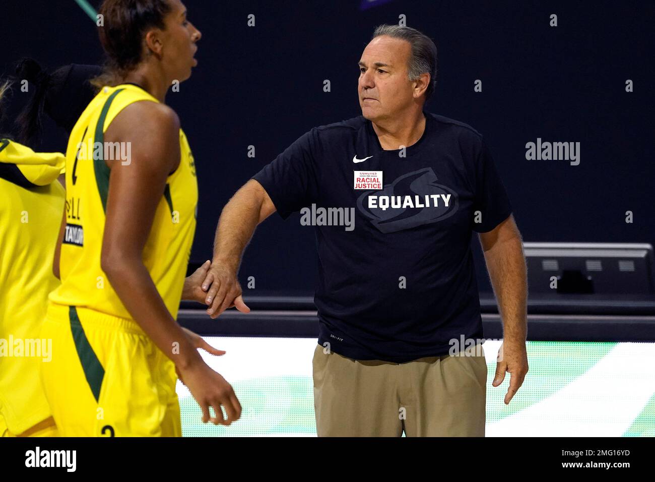 Seattle Storm head coach Gary Kloppenburg congratulates center Mercedes ...