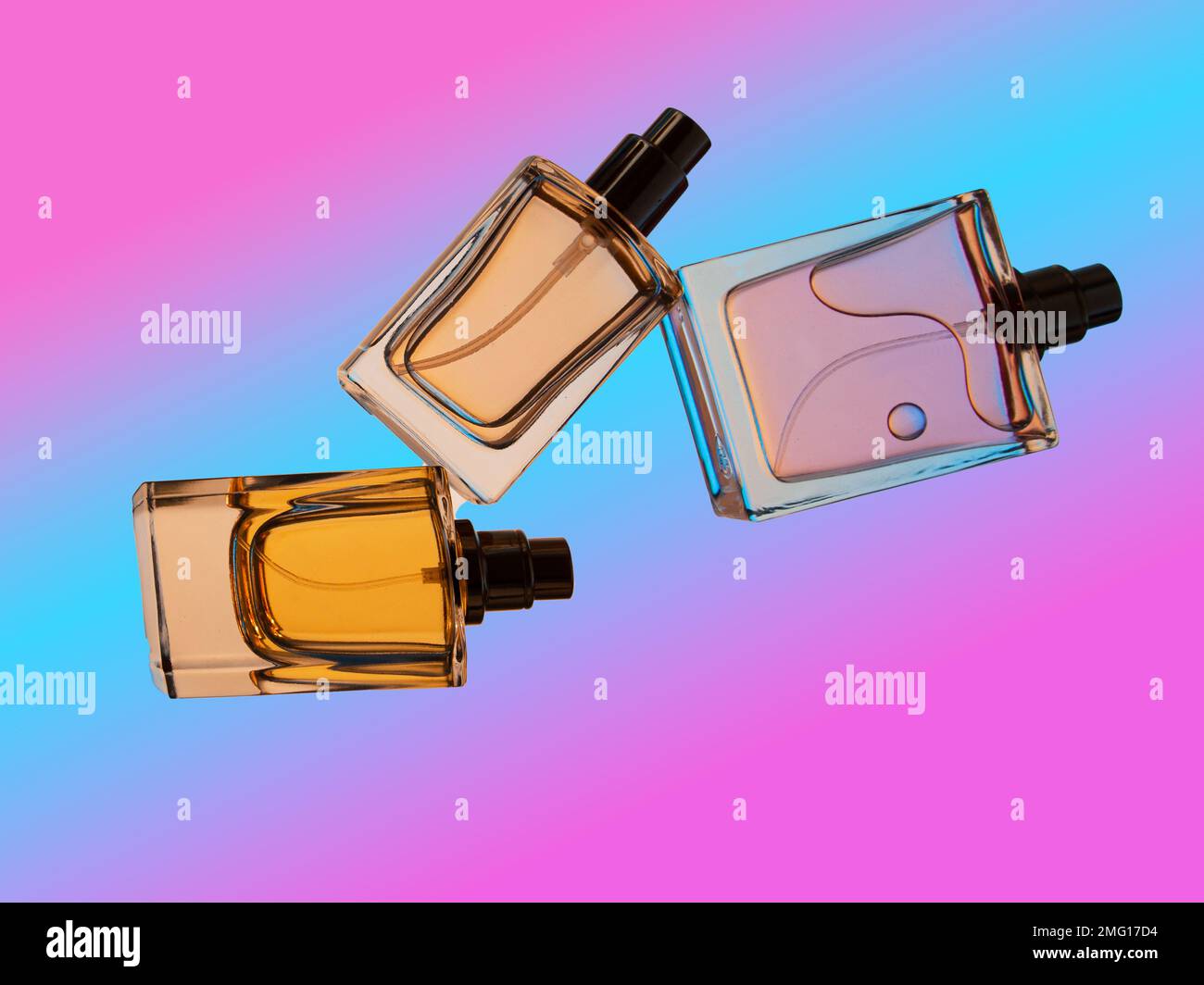 Levitation of set of perfume bottles on a purple background Stock Photo ...