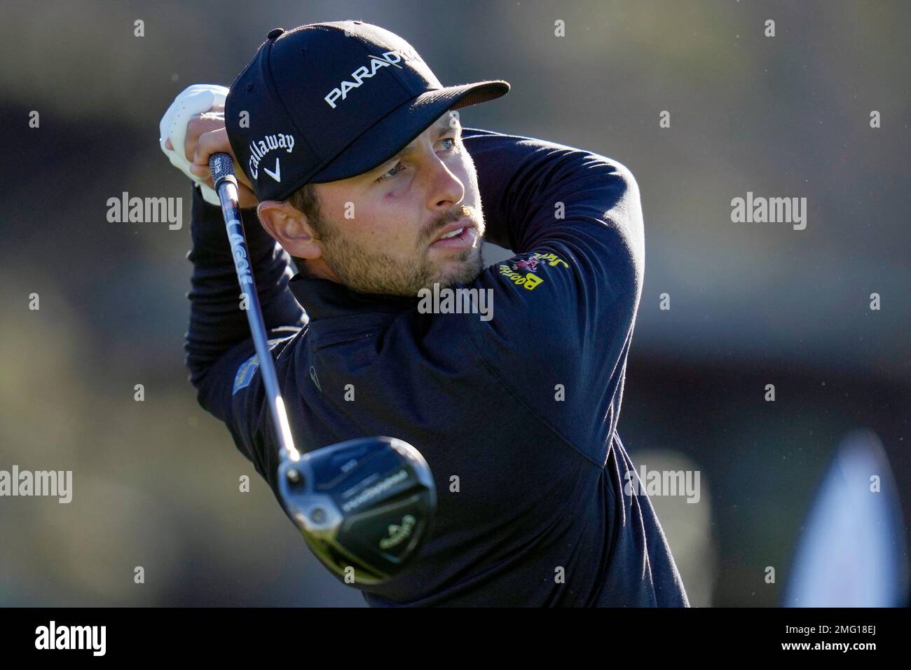 Adam Svensson, of Canada, watches his tee shot on the 10th hole of the ...
