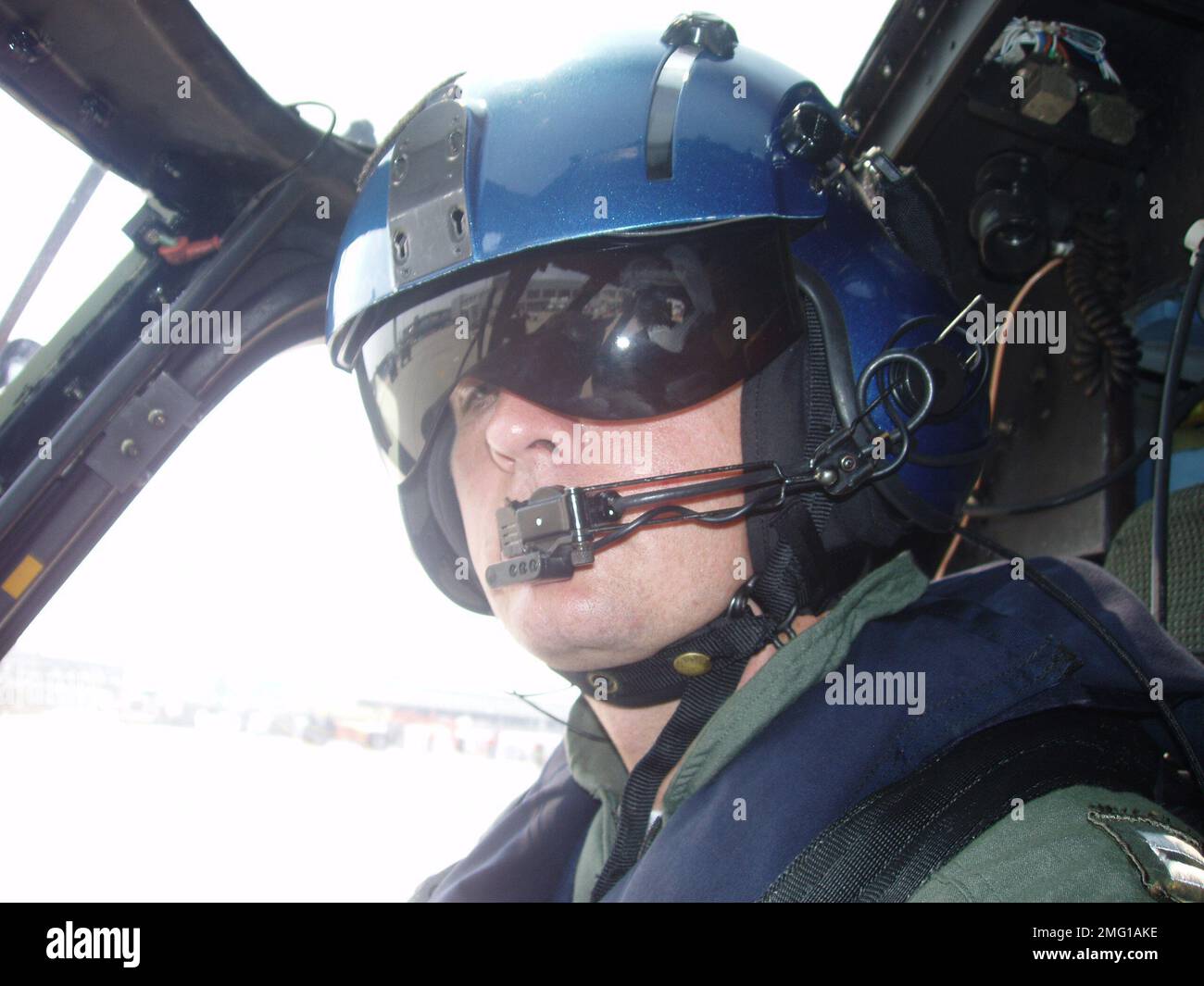 Coast Guard Personnel - Miscellaneous - 26-HK-90-155. Coast Guard pilot in cockpit2. Hurricane ...