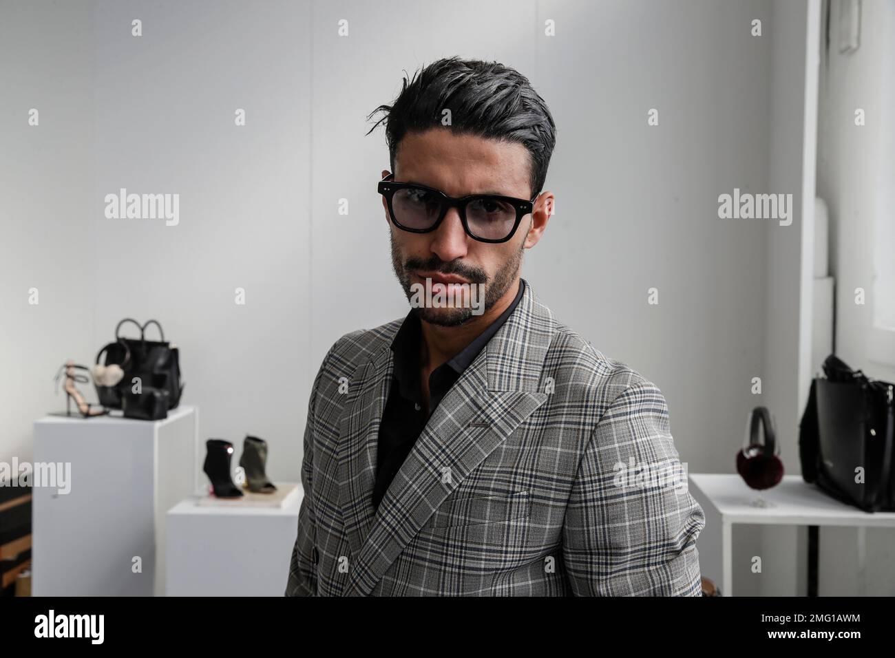 Fashion designer Karim Daoudi poses in front of his creations, in Milan ...